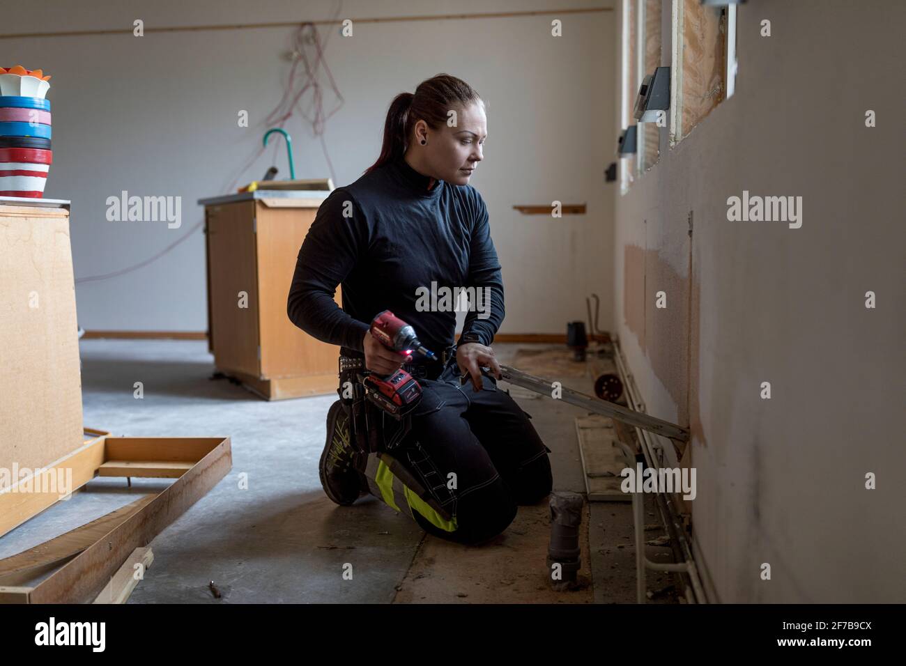 Woman renovating house Stock Photo - Alamy