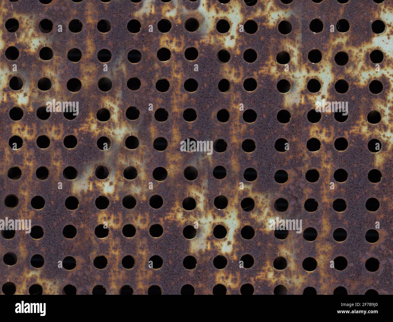 Texture of old rusty perforated metal with holes Stock Photo - Alamy