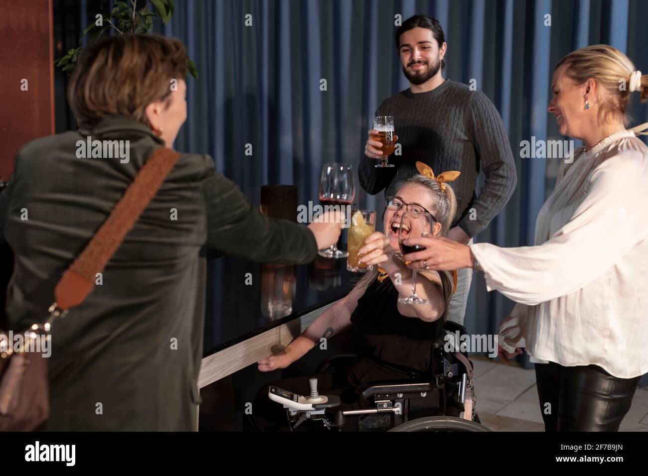 Group of friends having drink in bar Stock Photo - Alamy