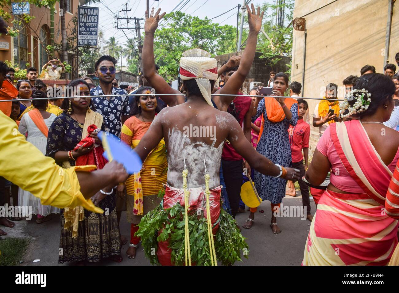 Bandel, India. 05th Apr, 2021. A devotee pierces his back skin with ...