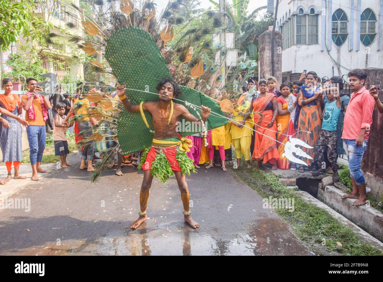 Bandel, India. 05th Apr, 2021. A devotee pierces his cheeks with a ...