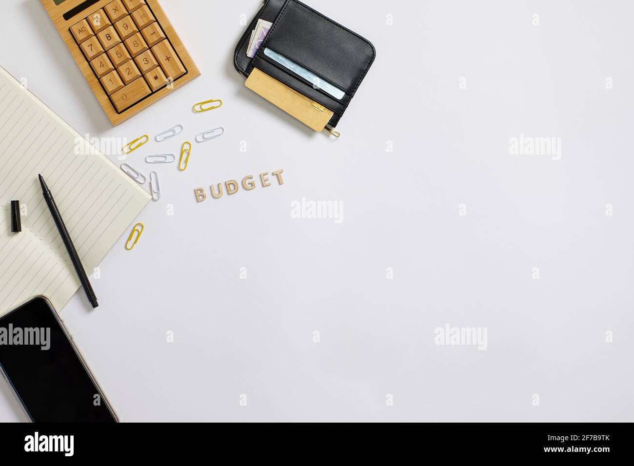 Wallet and calculator on desk Stock Photo - Alamy