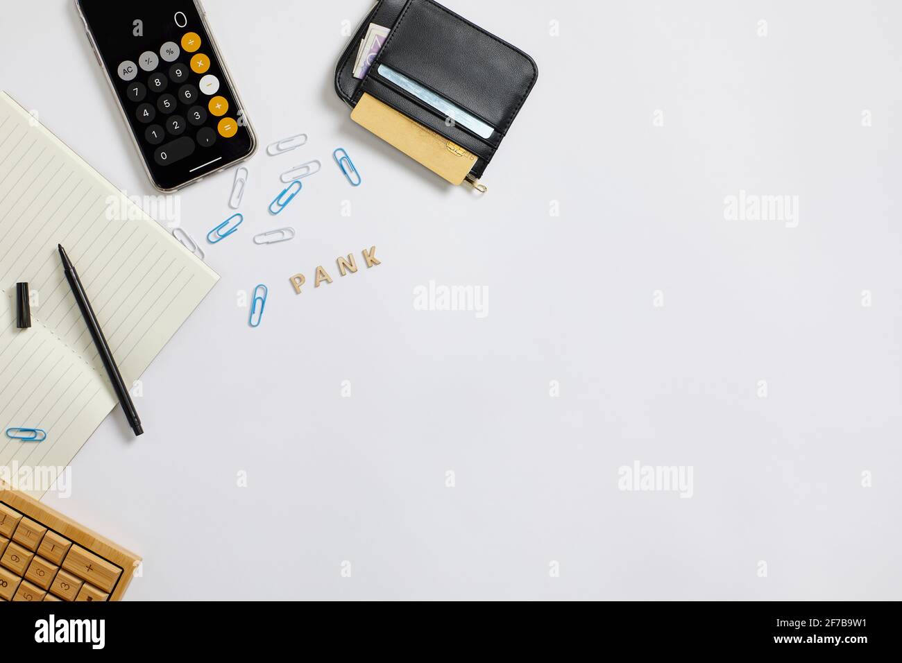 Wallet and calculator on desk Stock Photo - Alamy