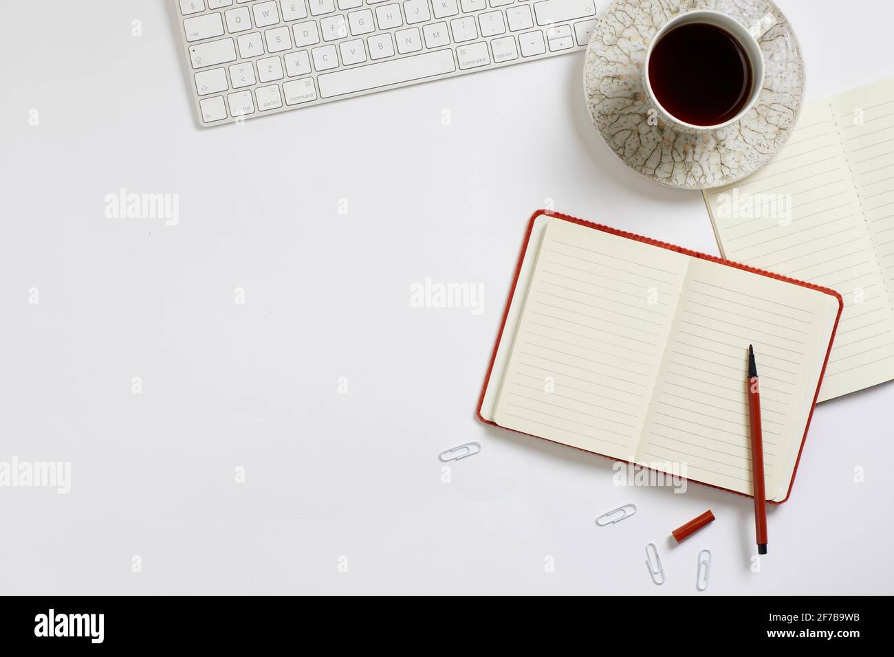 Coffee and notepad on desk Stock Photo - Alamy