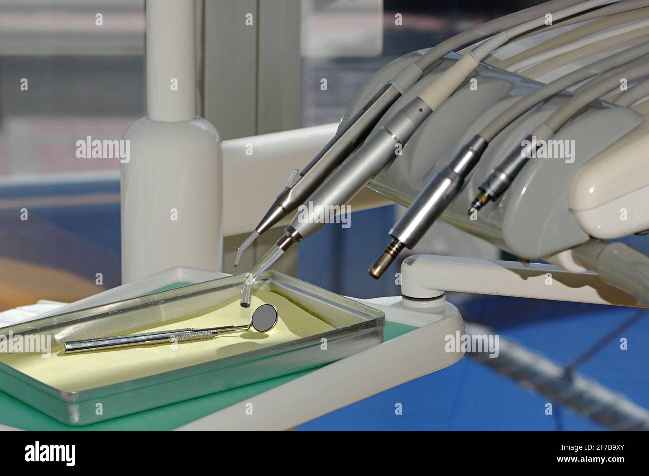 Dental tools set on an aluminium tray and other equipment at the ...
