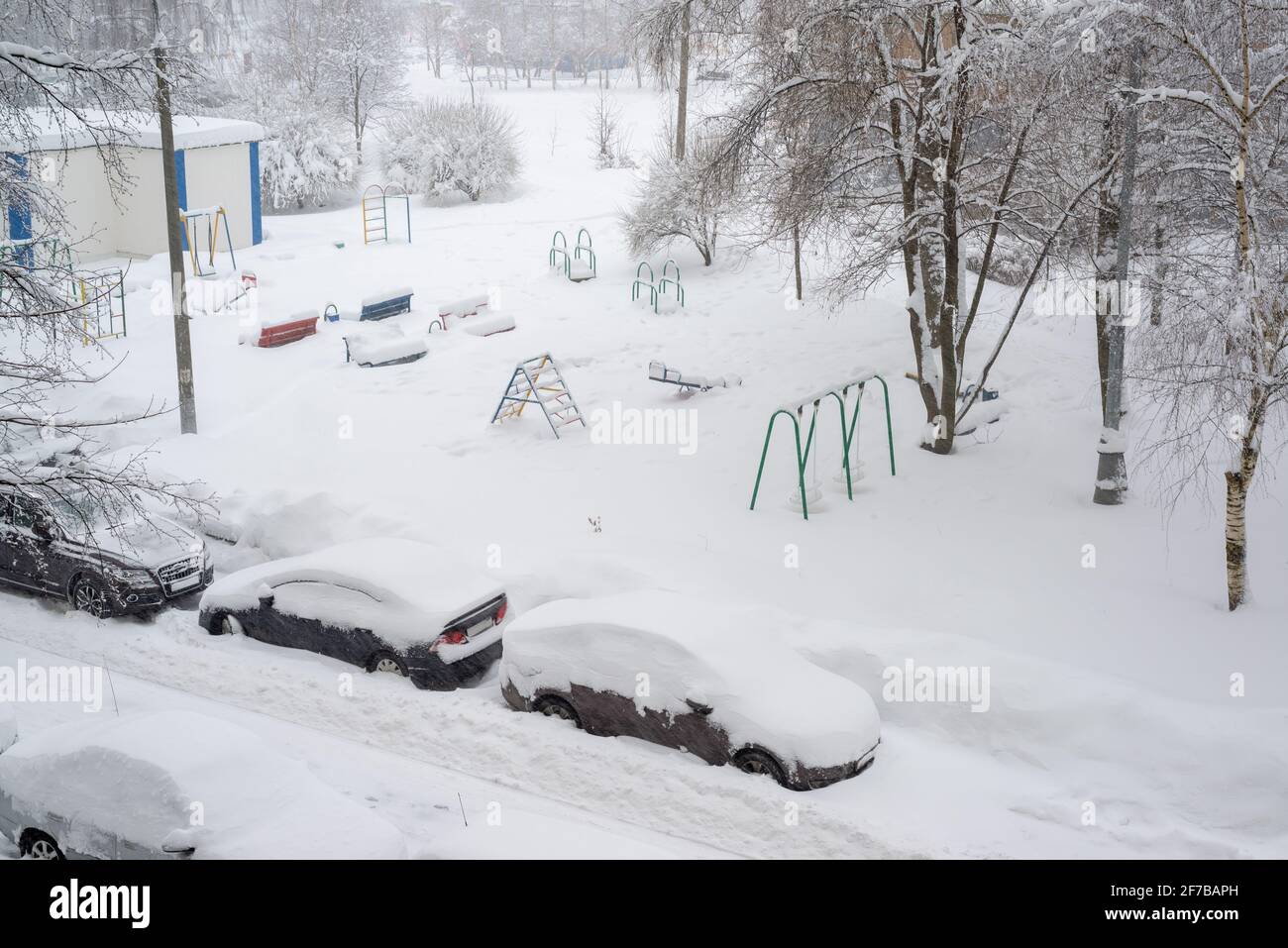 Snow-covered courtyard of a multi-storey residential building in Moscow ...