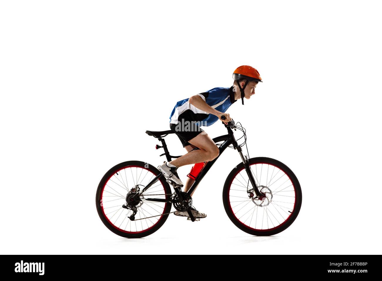 Young Caucasian boy bike rider with road bike isolated over white ...