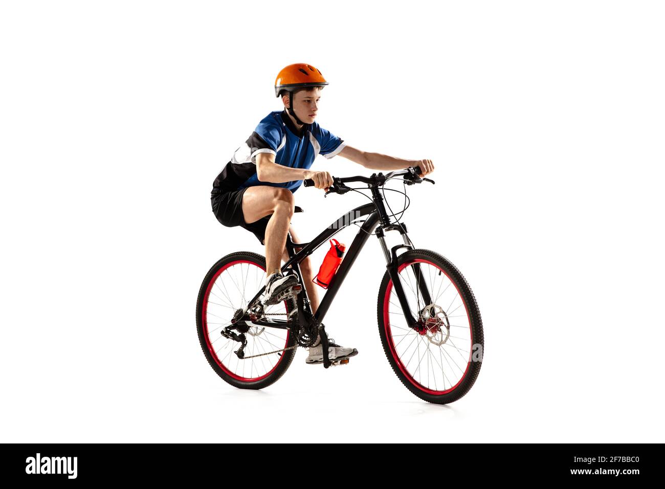 Young Caucasian boy bike rider with road bike isolated over white ...
