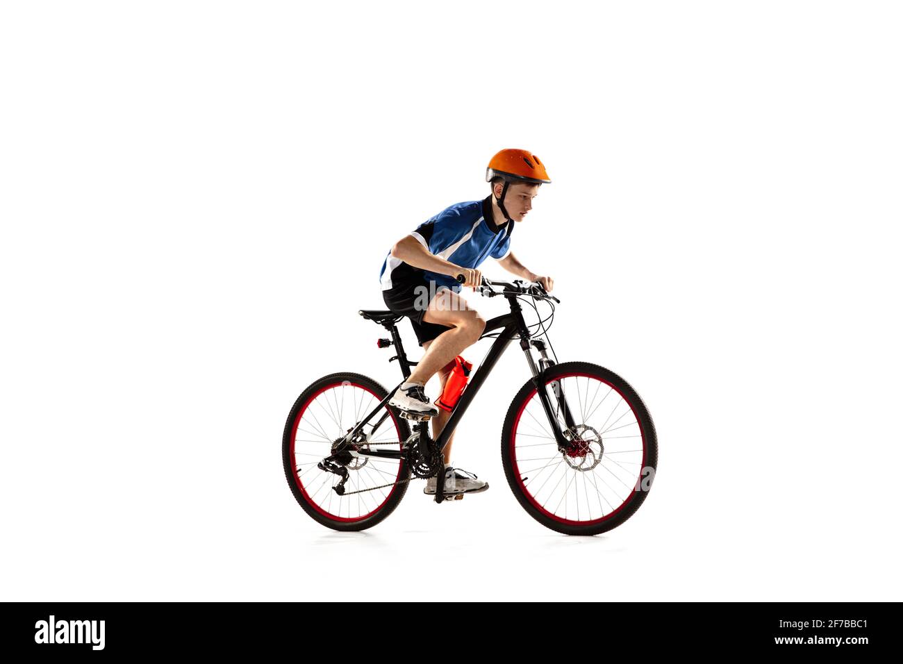 Young Caucasian boy bike rider with road bike isolated over white ...
