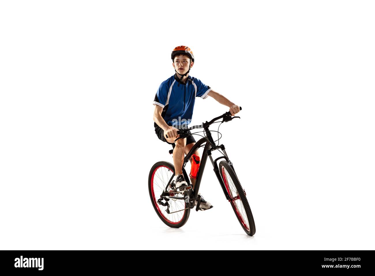 Young Caucasian boy bike rider with road bike isolated over white ...