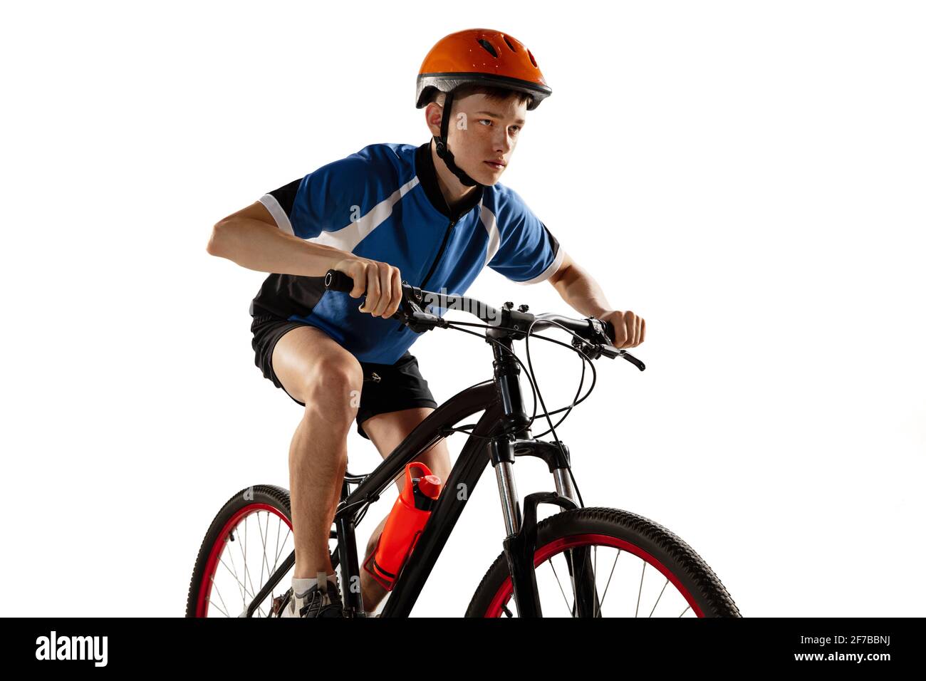 Young Caucasian boy bike rider on road bike isolated over white ...