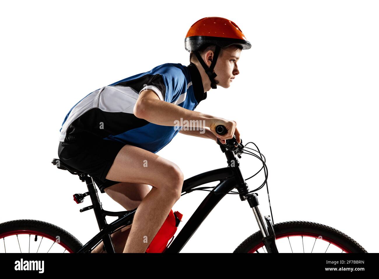 Young Caucasian boy bike rider on road bike isolated over white ...