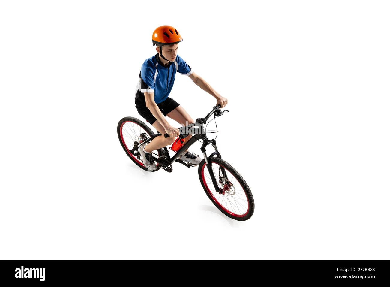 Young Caucasian boy bike rider on road bike isolated over white ...