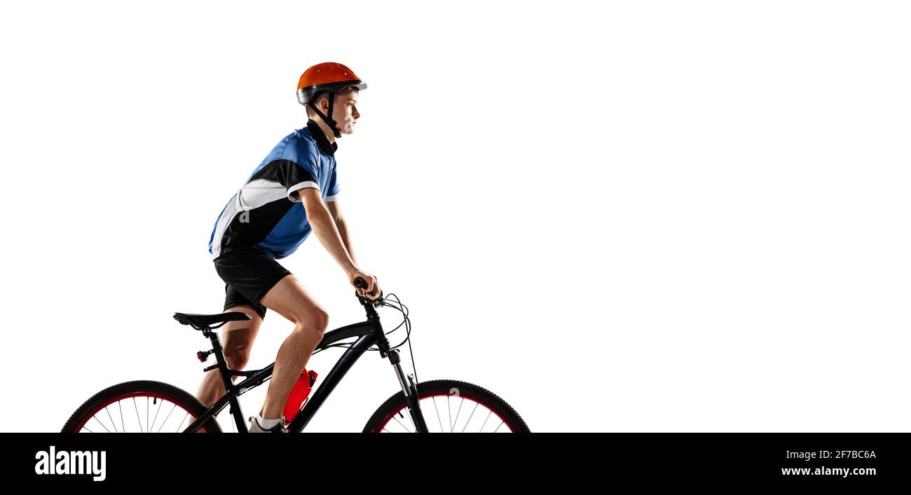 Young Caucasian boy bike rider with road bike isolated over white ...