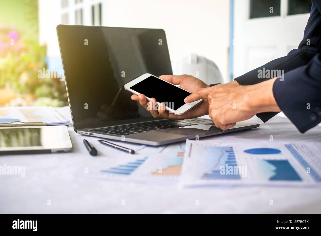 Hand using mobile phone in office work ,Man using smartphone in work ...