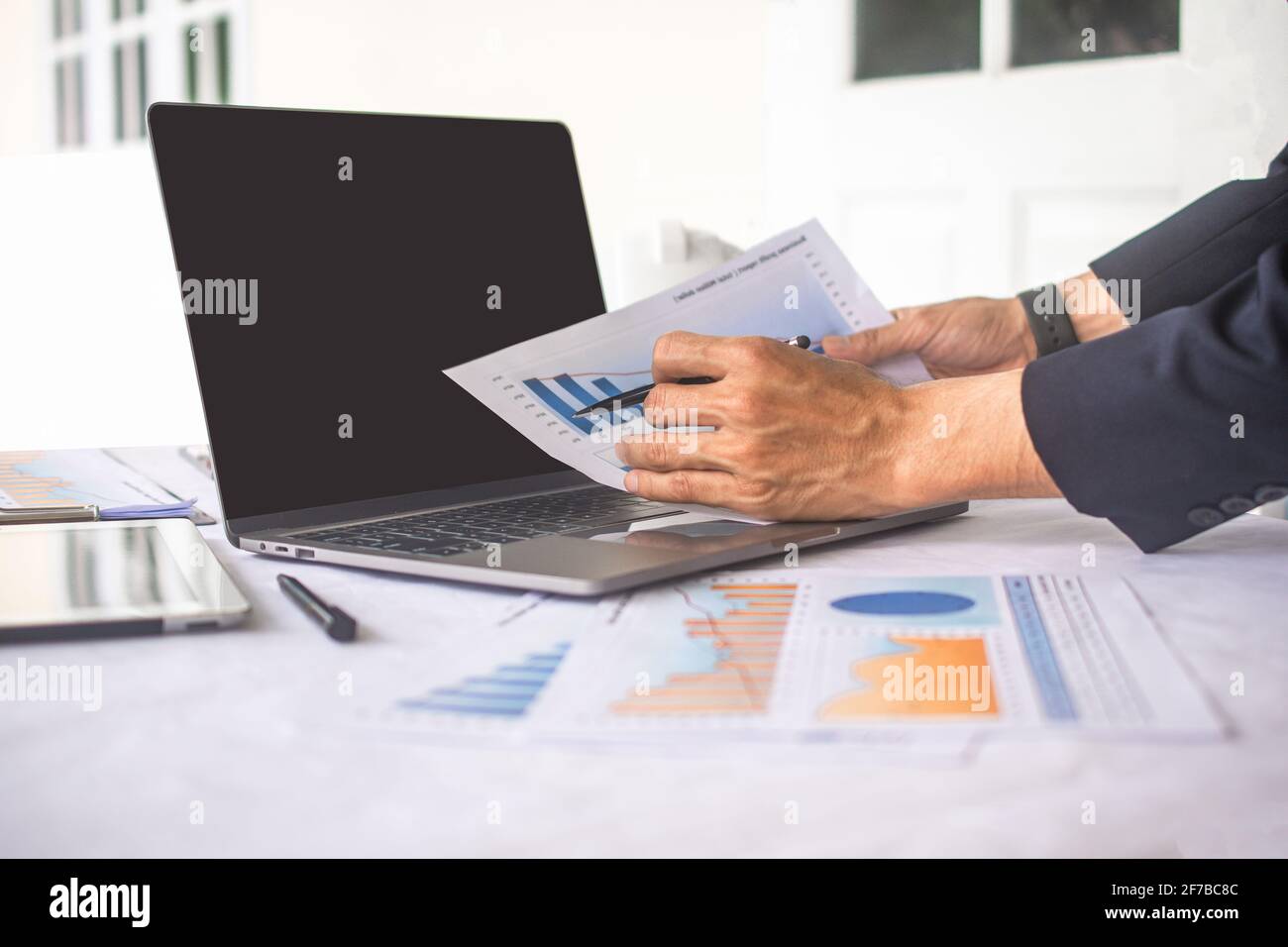 Hand holding paper report business for working in office , Businessman ...