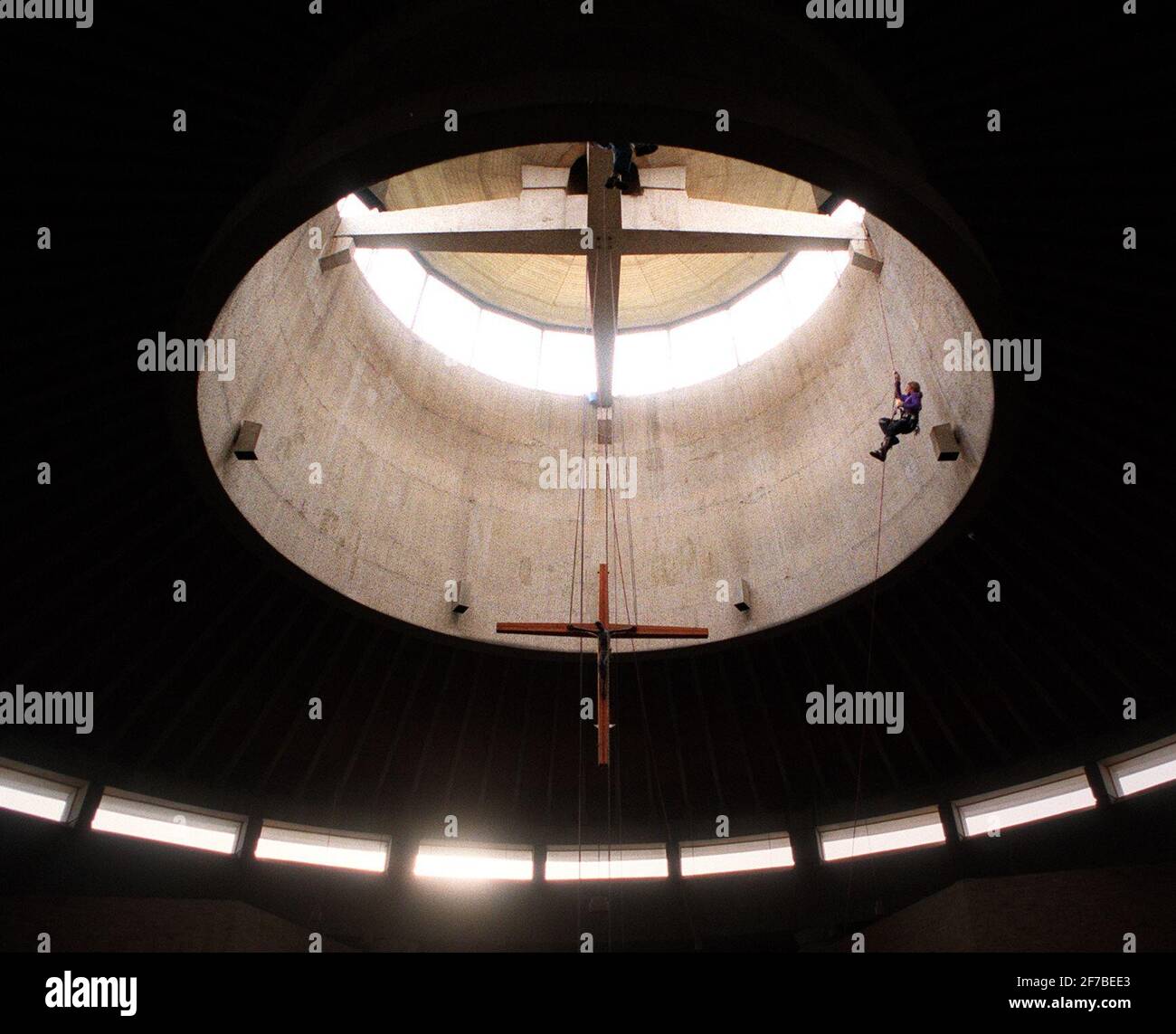 German climbers cleaning Worth Abbey December 1998 windows at the top ...