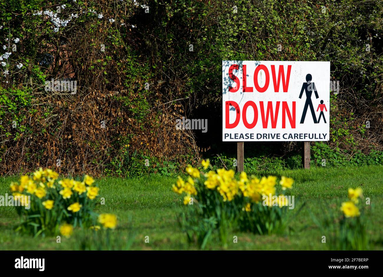 Sign requesting drivers to slow down through village, England UK Stock ...