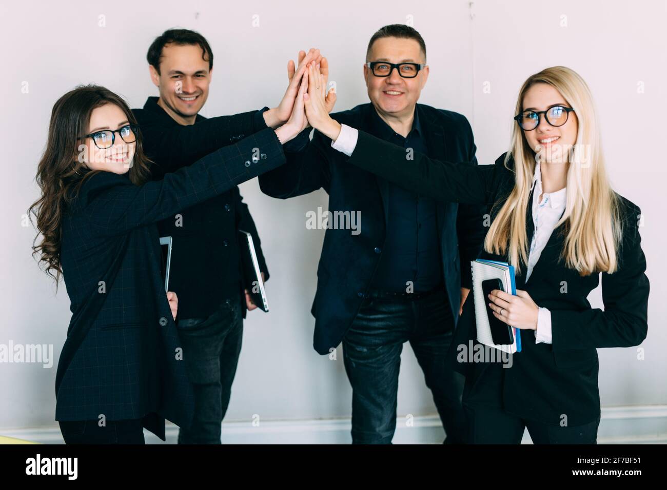 Happy business team making hi-res stock photography and images - Alamy