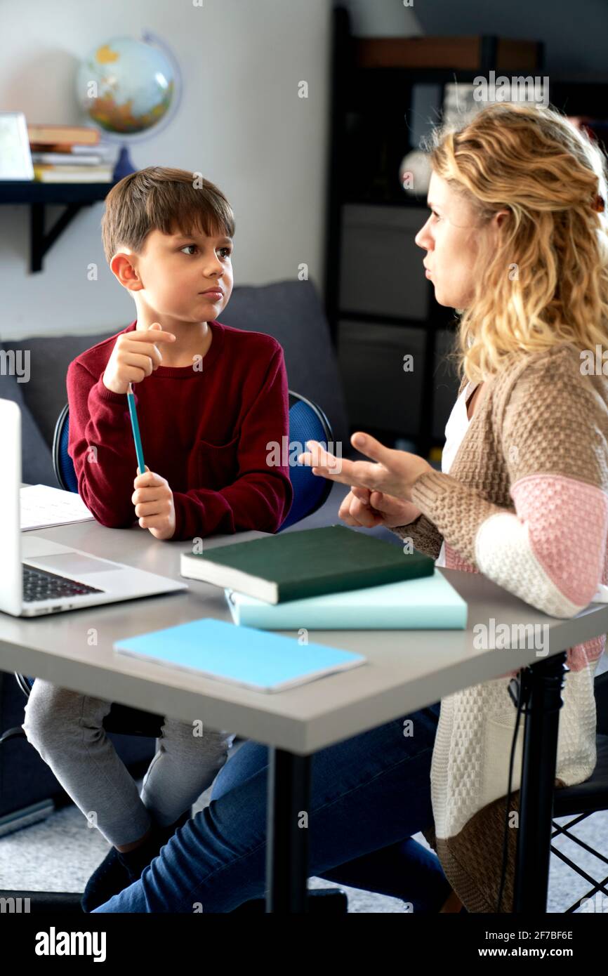 Mother and son study together at home Stock Photo - Alamy