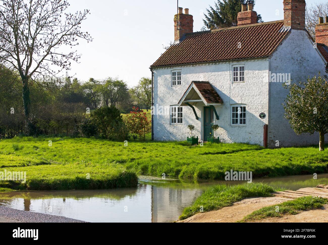 Cottage and ford in the village of Lockington, East Yorkshire, England ...