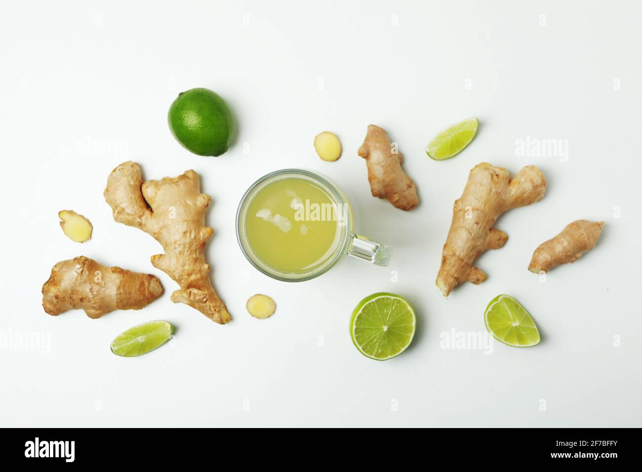 Glass of ginger beer and ingredients on white background Stock Photo ...