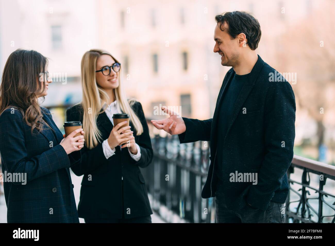 Happy work team during break time in office Stock Photo - Alamy