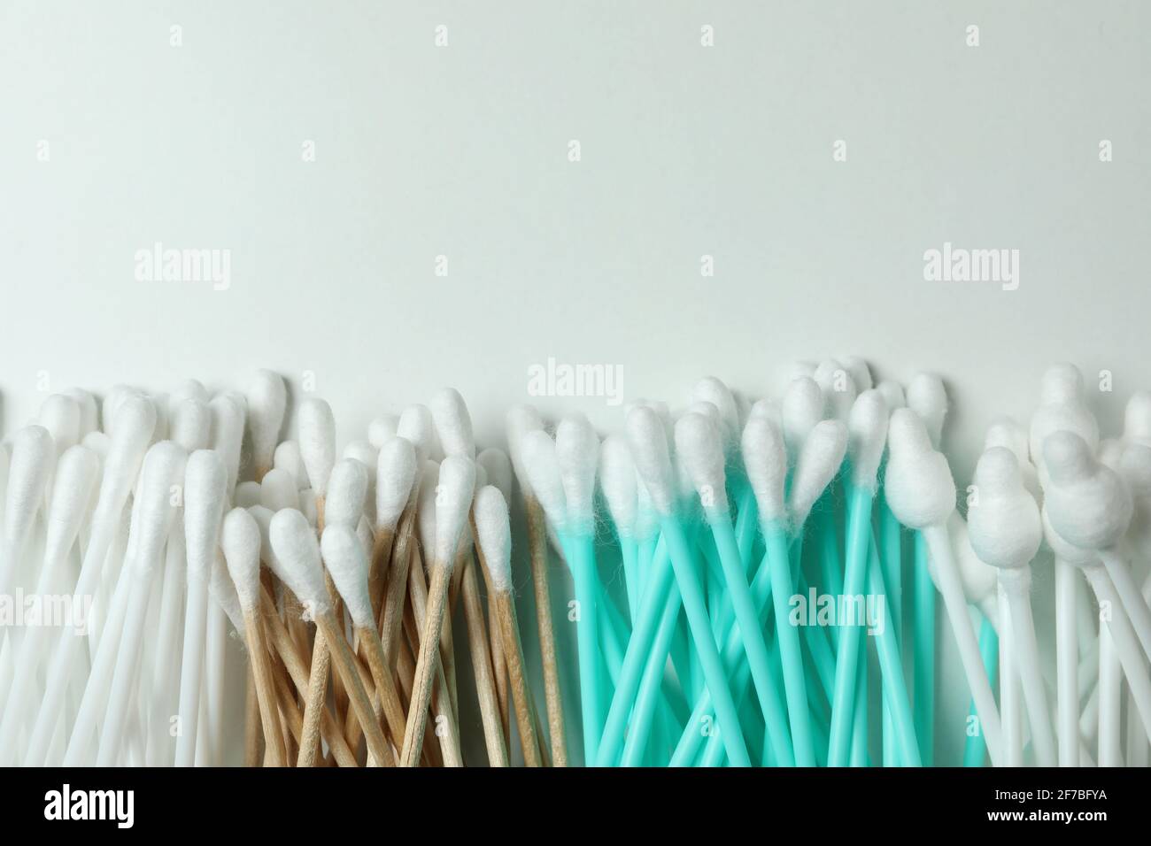 Different cotton swabs on white background, space for text Stock Photo ...