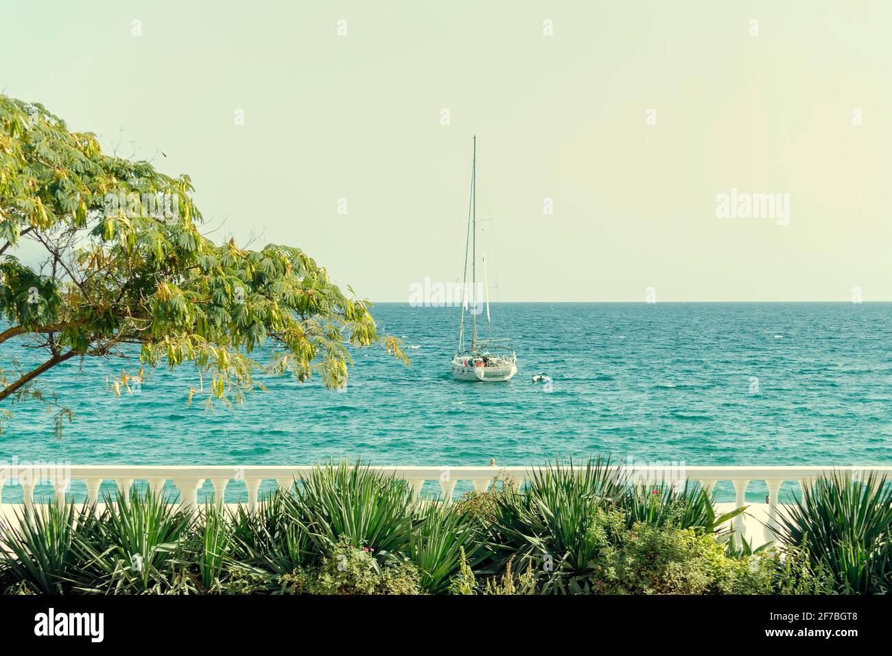 Sailing yacht with a deflated sail Stock Photo - Alamy