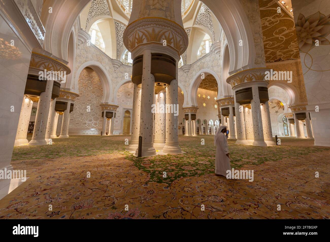 Man with cellphone walks in the main prayer hall in the Sheikh Zayed ...