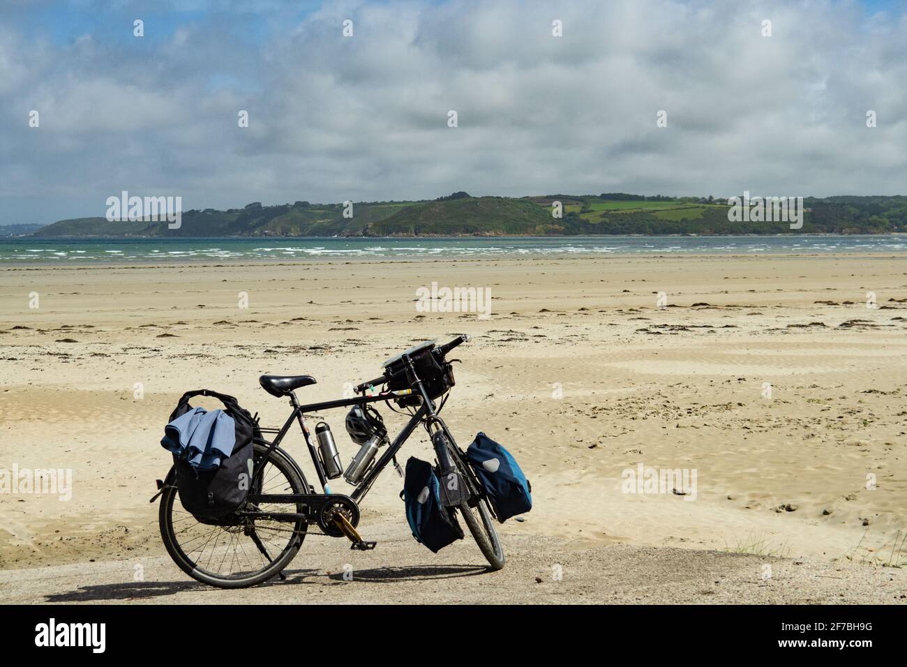 A heavily packed touring bicycle on a beach in Brittany, France Stock ...