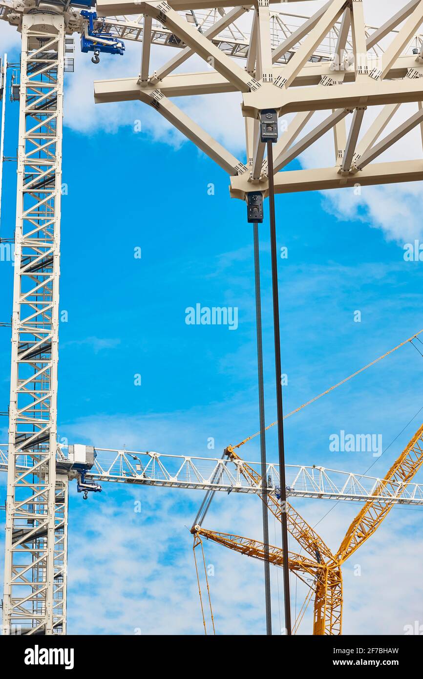 Several cranes in working area. Construction engineering industry Stock ...