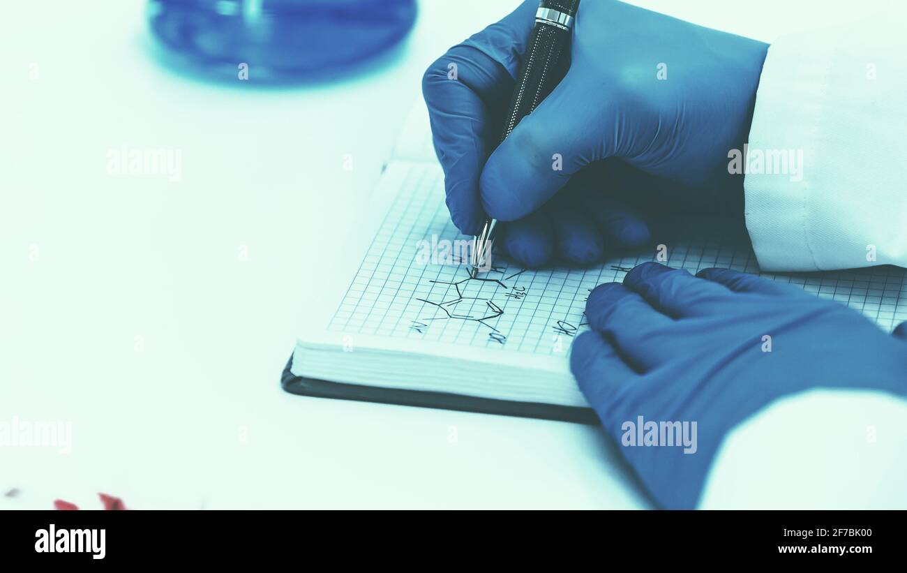 Male scientist writing notes in hi-res stock photography and images - Alamy