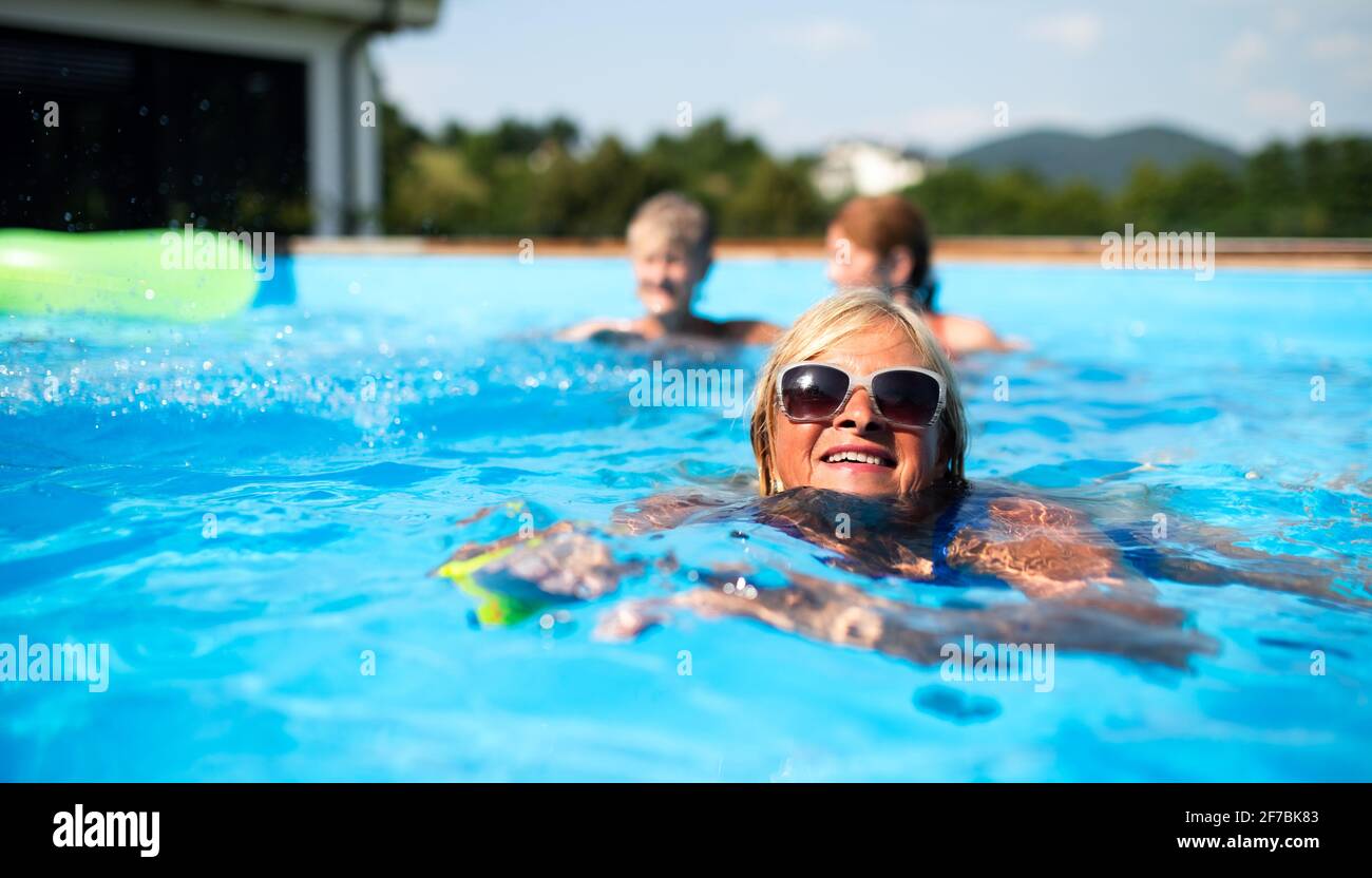 Senior woman in swimsuit swimming hi-res stock photography and images ...