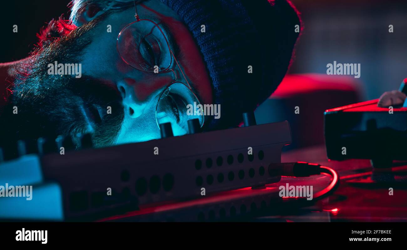 Close-up of musician performing in neon light. Concept of advertising ...