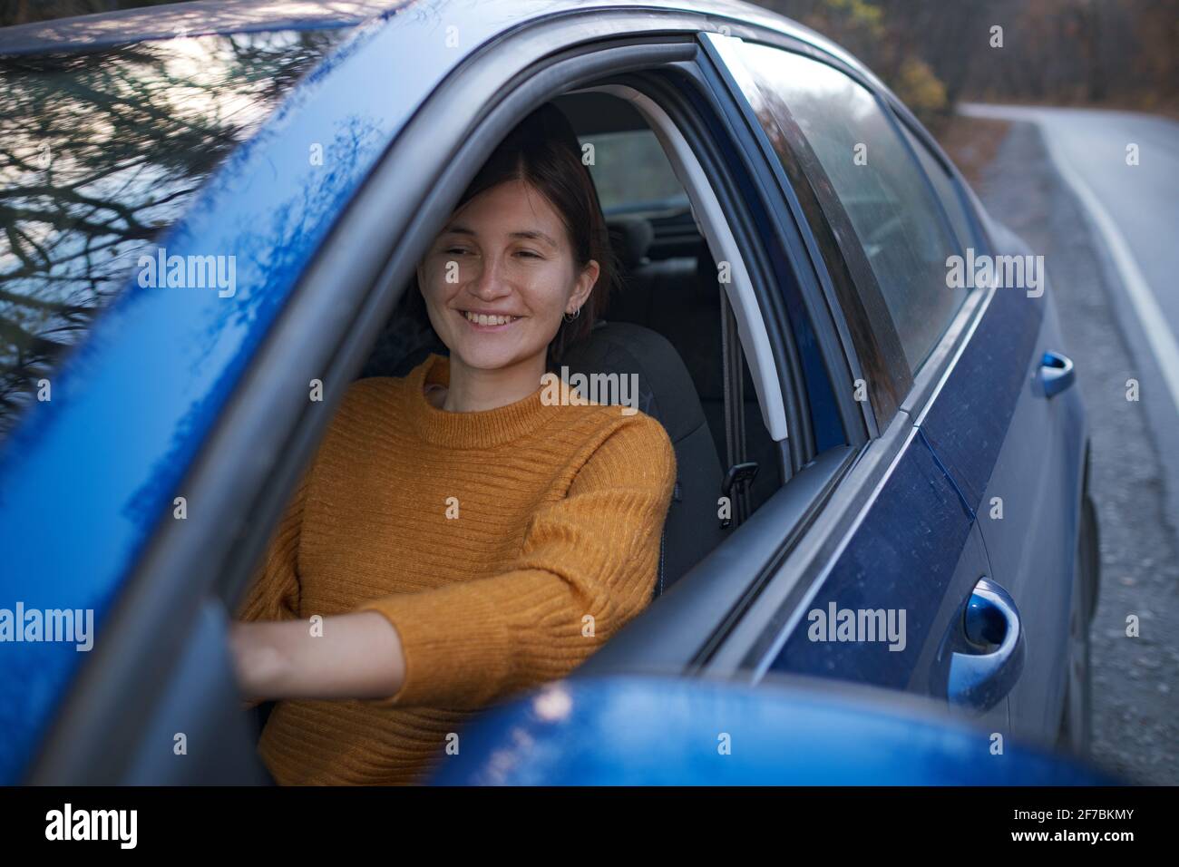 Woman car alone happy drive view hi-res stock photography and images ...