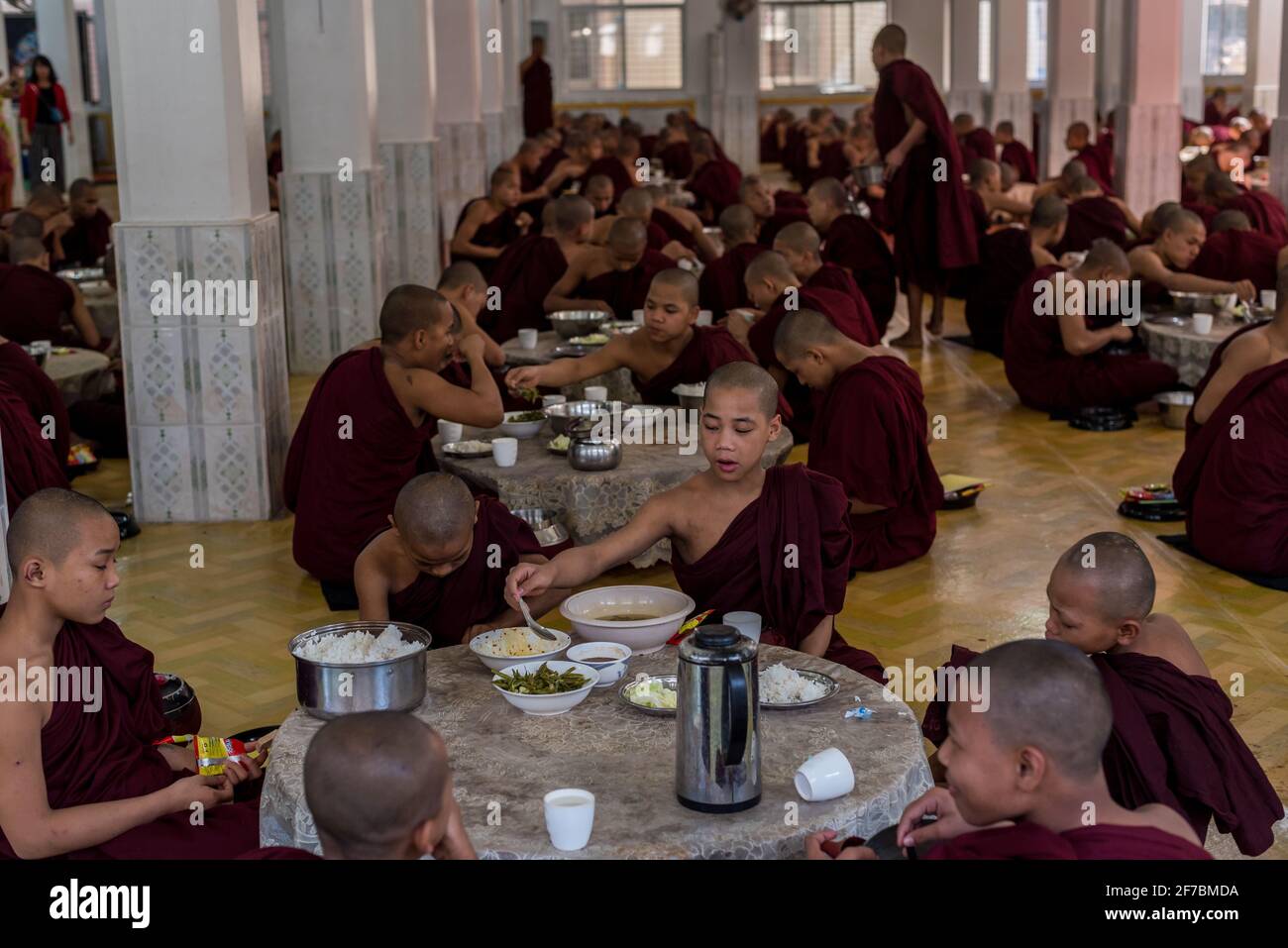 Monks eating lunch at the Kya Khat Monastery in Bago, Myanmar Stock ...