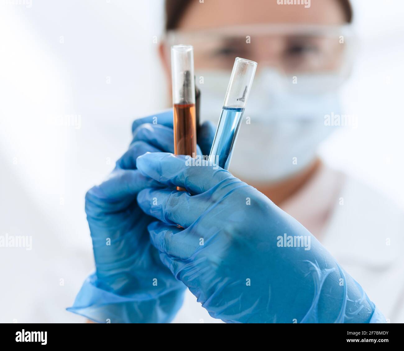 close up. female scientist marks tubes with tests Stock Photo - Alamy