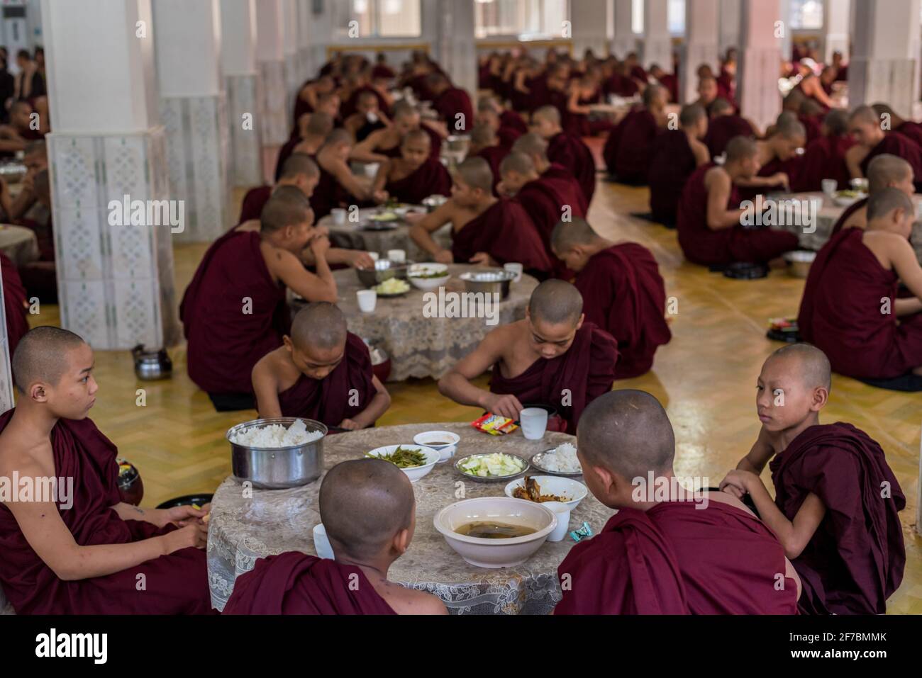 Monks eating lunch at the Kya Khat Monastery in Bago, Myanmar Stock ...