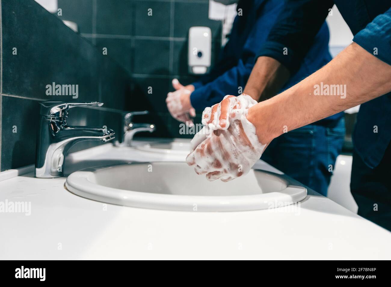 close up. employees wash their hands thoroughly Stock Photo - Alamy