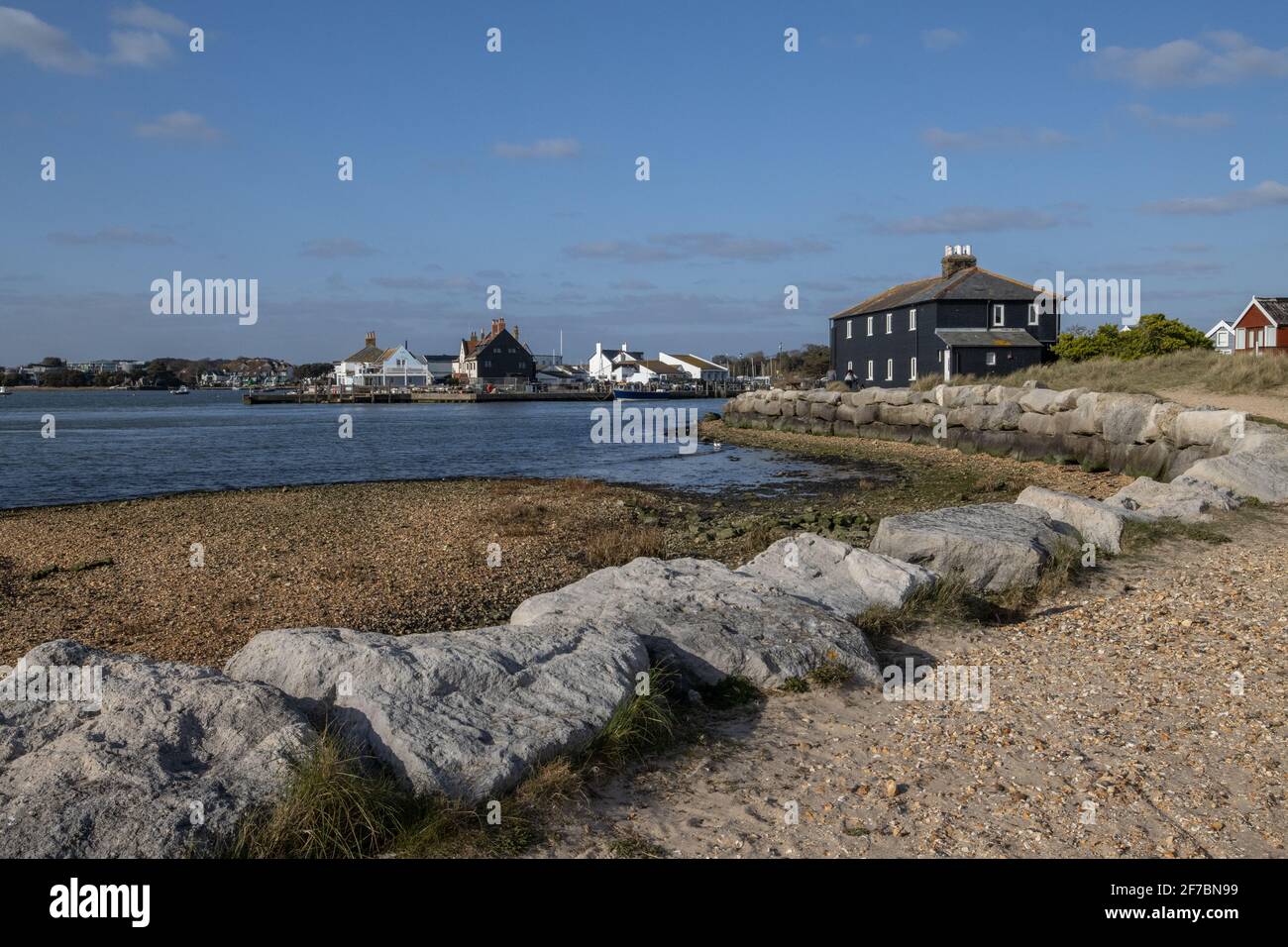 Mudeford Sandspit, stretch of sandbanks decorated with rows of beach ...