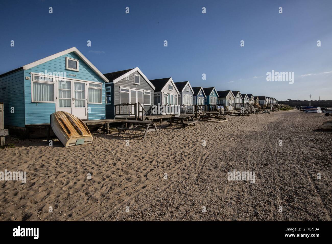 Mudeford Sandspit, stretch of sandbanks decorated with rows of beach ...