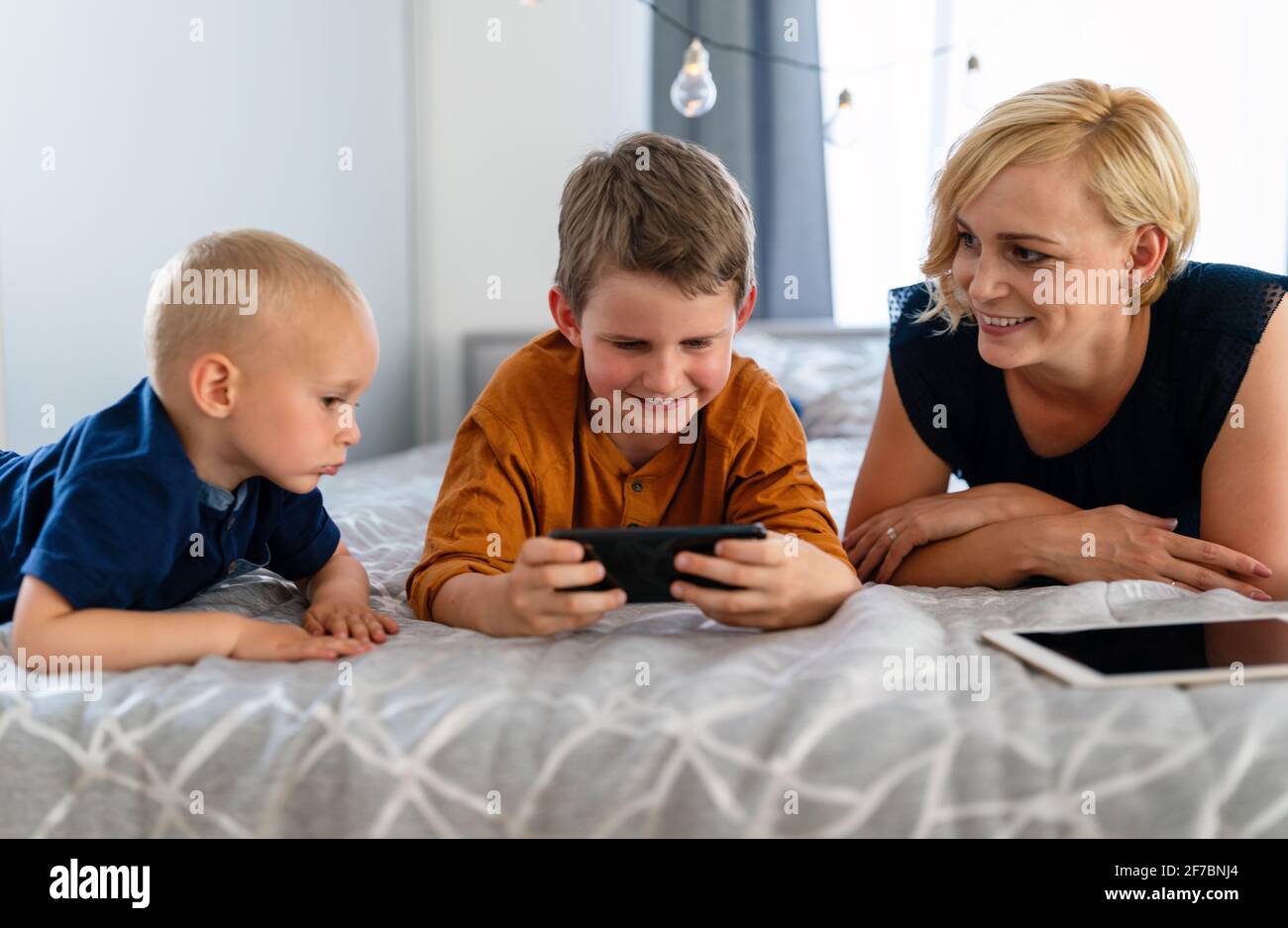 Technology addicted family parent and kids use digital devices ...