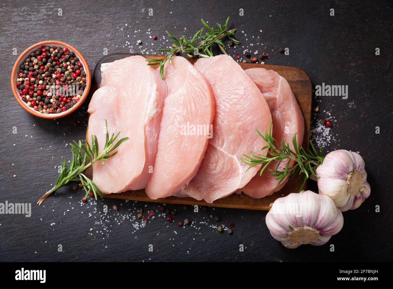 fresh turkey meat with rosemary on a wooden board, top view Stock Photo ...