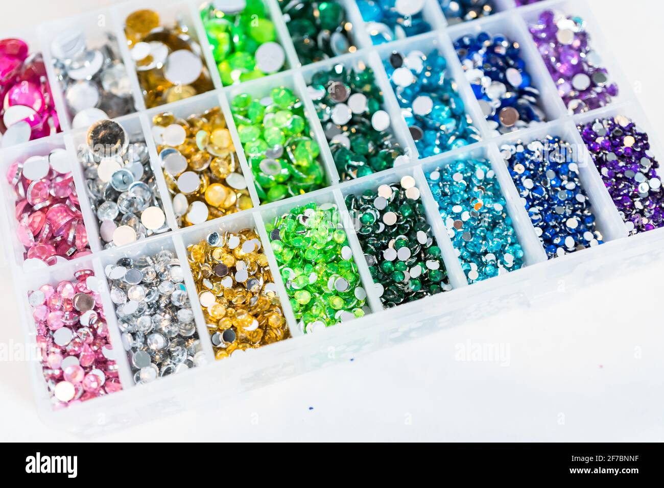 Color and size variety of rhinestones in the craft box Stock Photo - Alamy