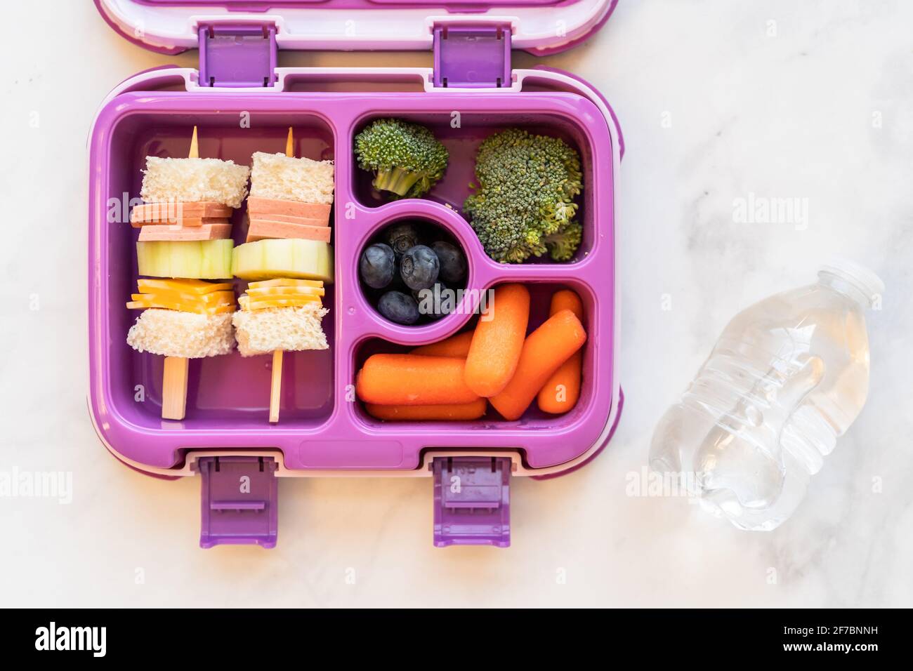 Flat lay. Healthy school lunch with kebab sandwich and vegetables in ...