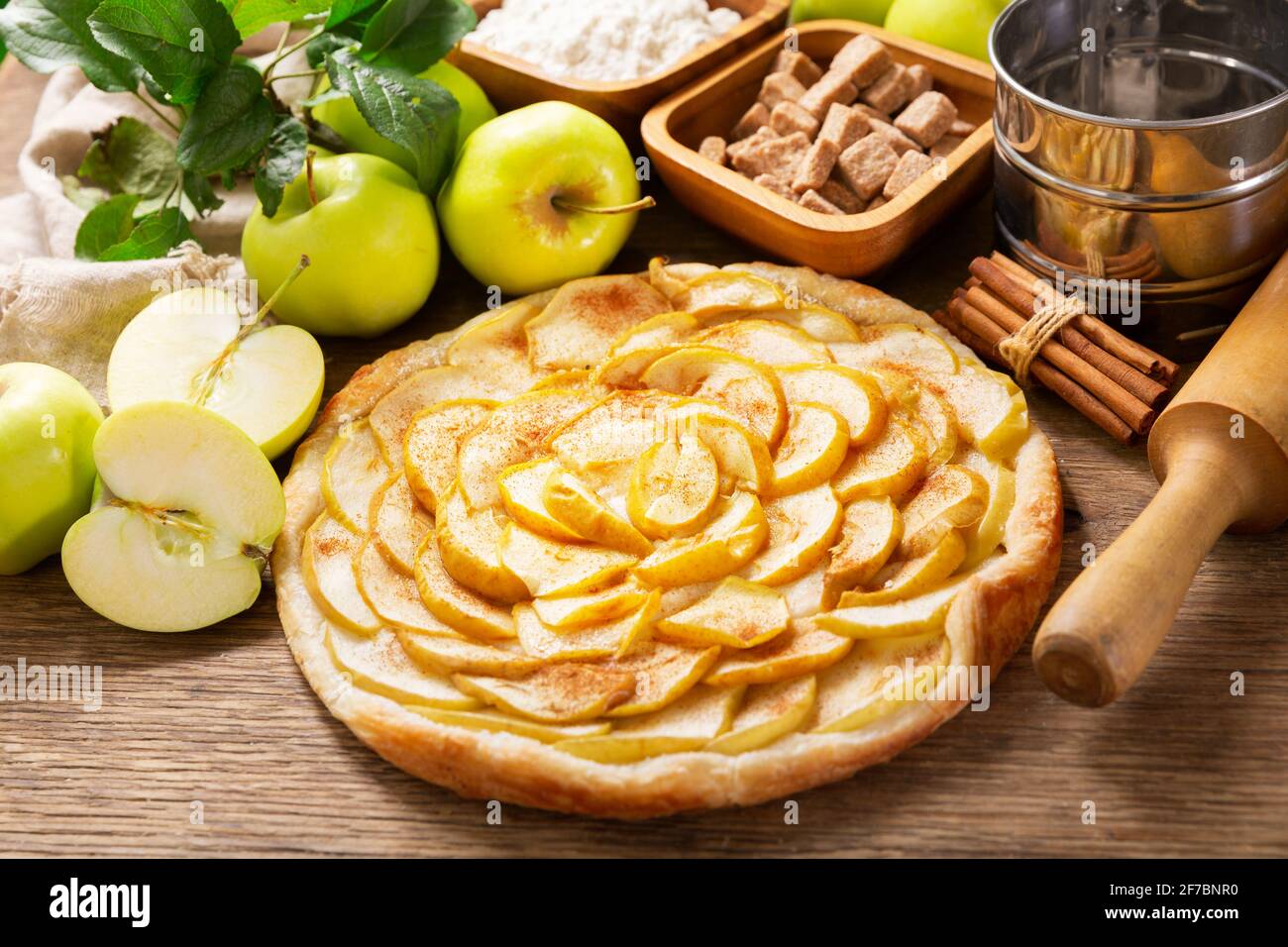 apple pie with fresh fruits on a wooden table Stock Photo - Alamy
