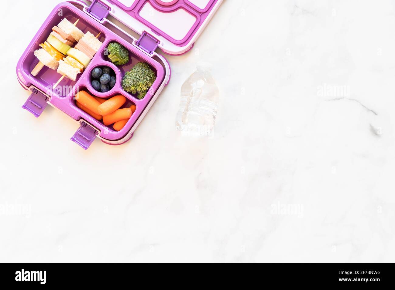 Flat lay. Healthy school lunch with kebab sandwich and vegetables in ...