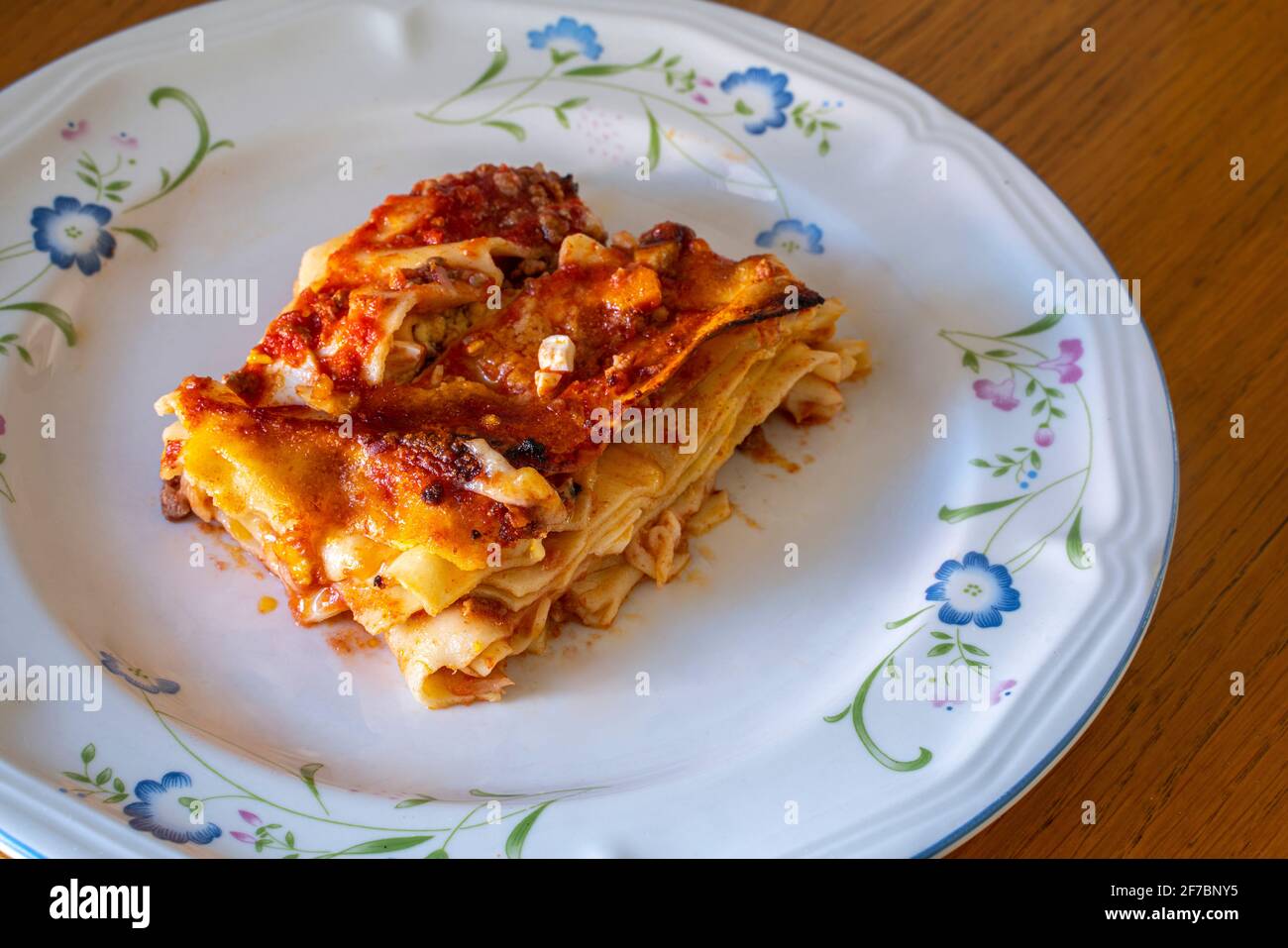 Portion of homemade lasagna with eggs, tomato sauce, handmade pasta ...