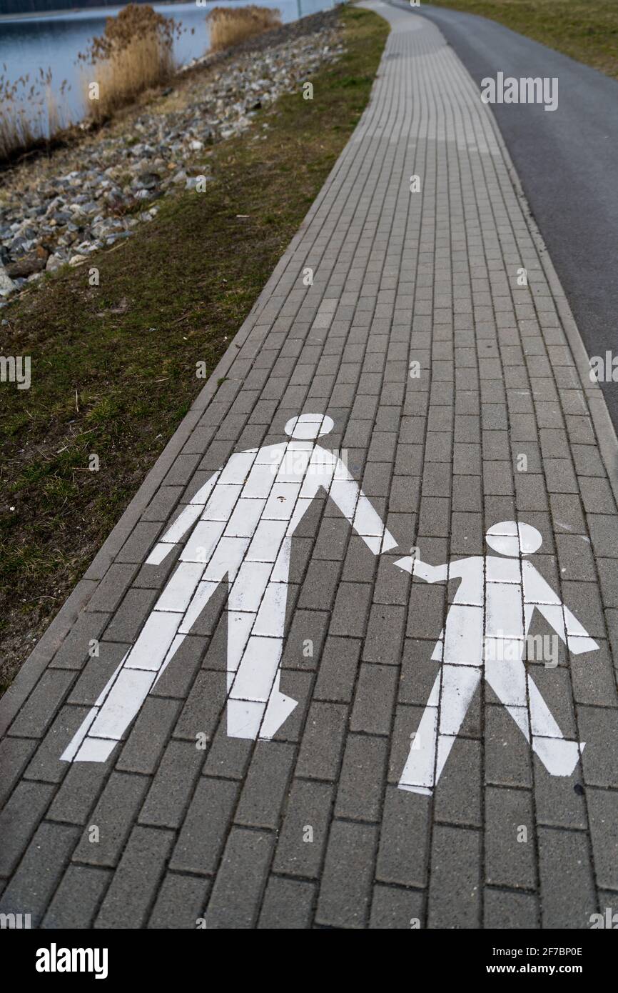 Pedestrian walkway, walk with child, symbol in white Stock Photo - Alamy